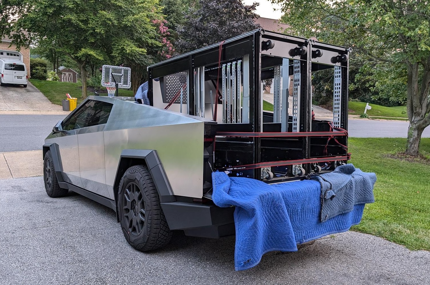Cybertruck doing Cyber stuff -- hauling two full-sized server racks ...
