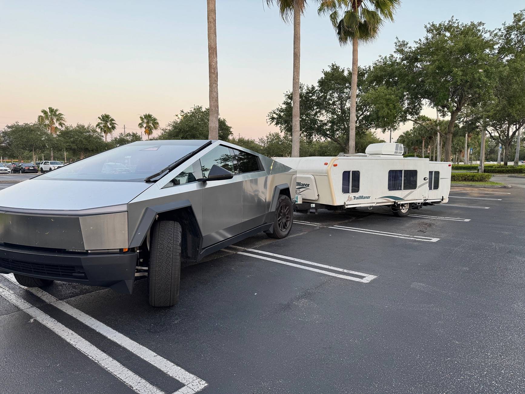 Just got a Trailmanor hard shell pop up camper -- towing stats | Tesla ...